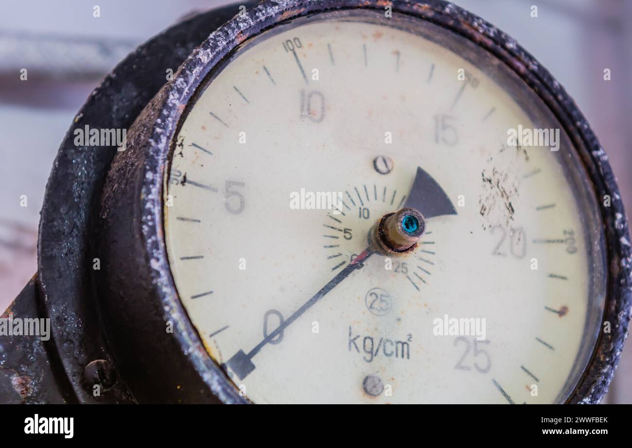 Closeup of old pressure gauge with blurred white background in ...
