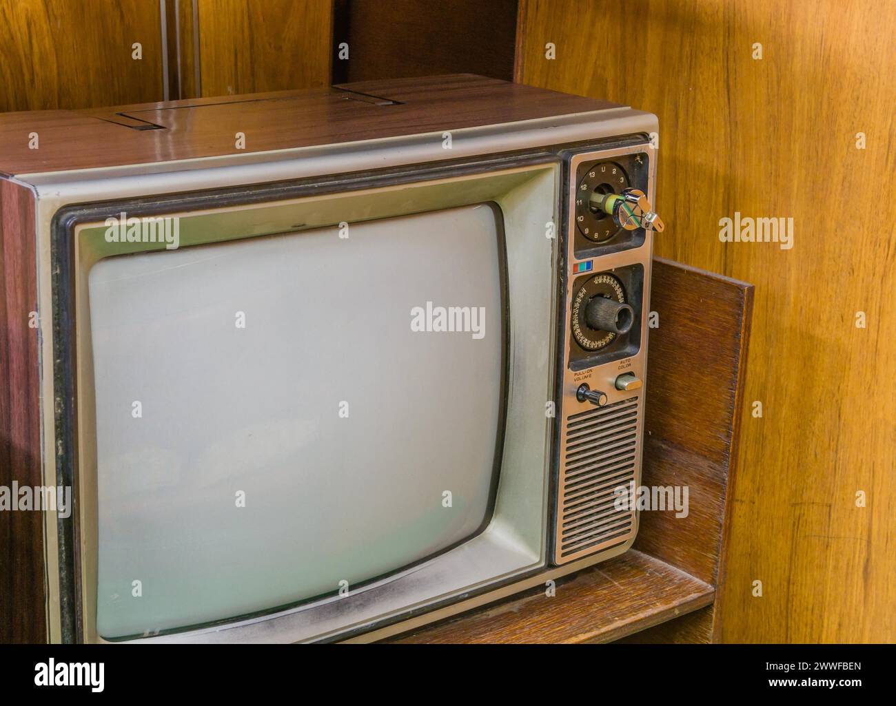 Old nineteen inch television set with wood grain chassis sitting on ...
