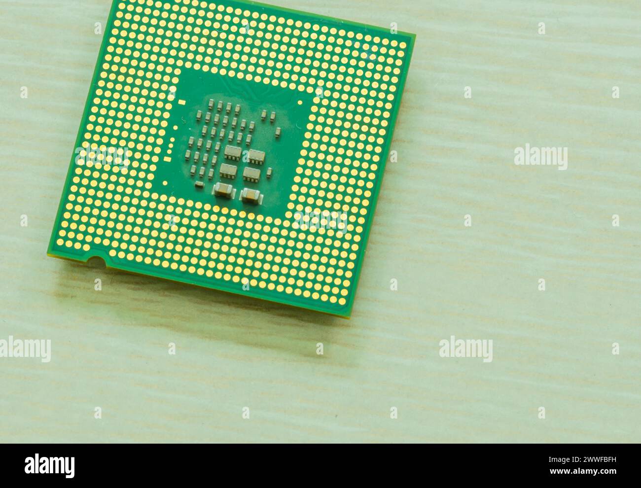 Bottom side of central processor unit (CPU) on blurred wood grain table top Stock Photo - Alamy