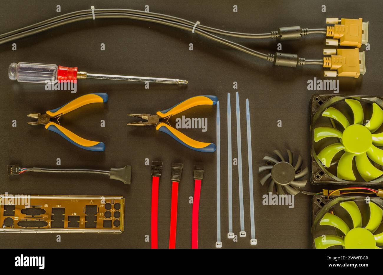 Flat lay of various computer tools and parts on black background Stock ...