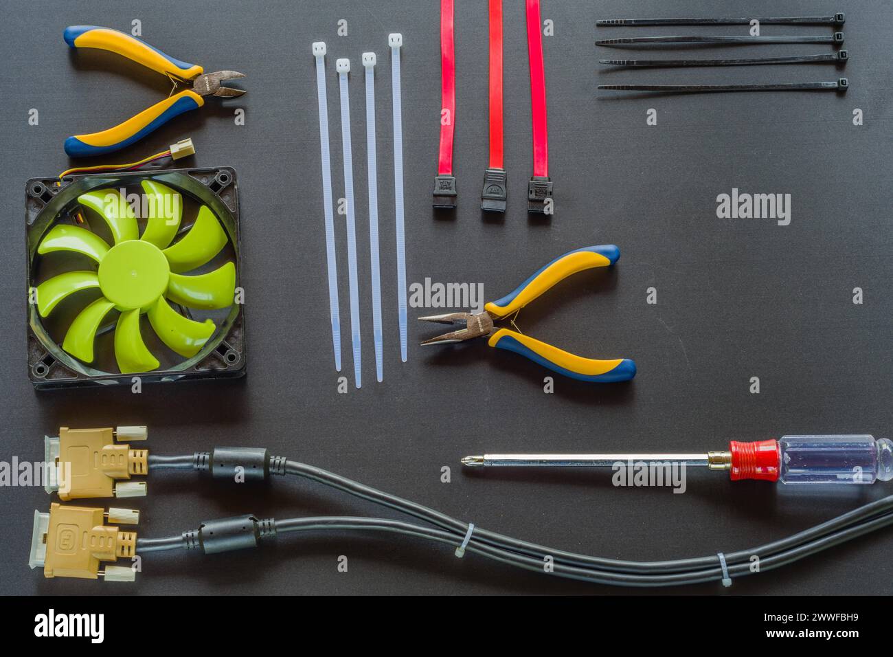 Flat lay of various computer tools and parts on black background Stock ...