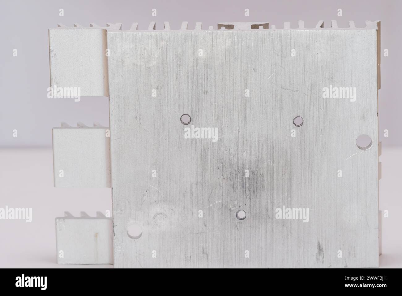 Closeup of mounting surface of rectangle aluminum heat sink on white ...