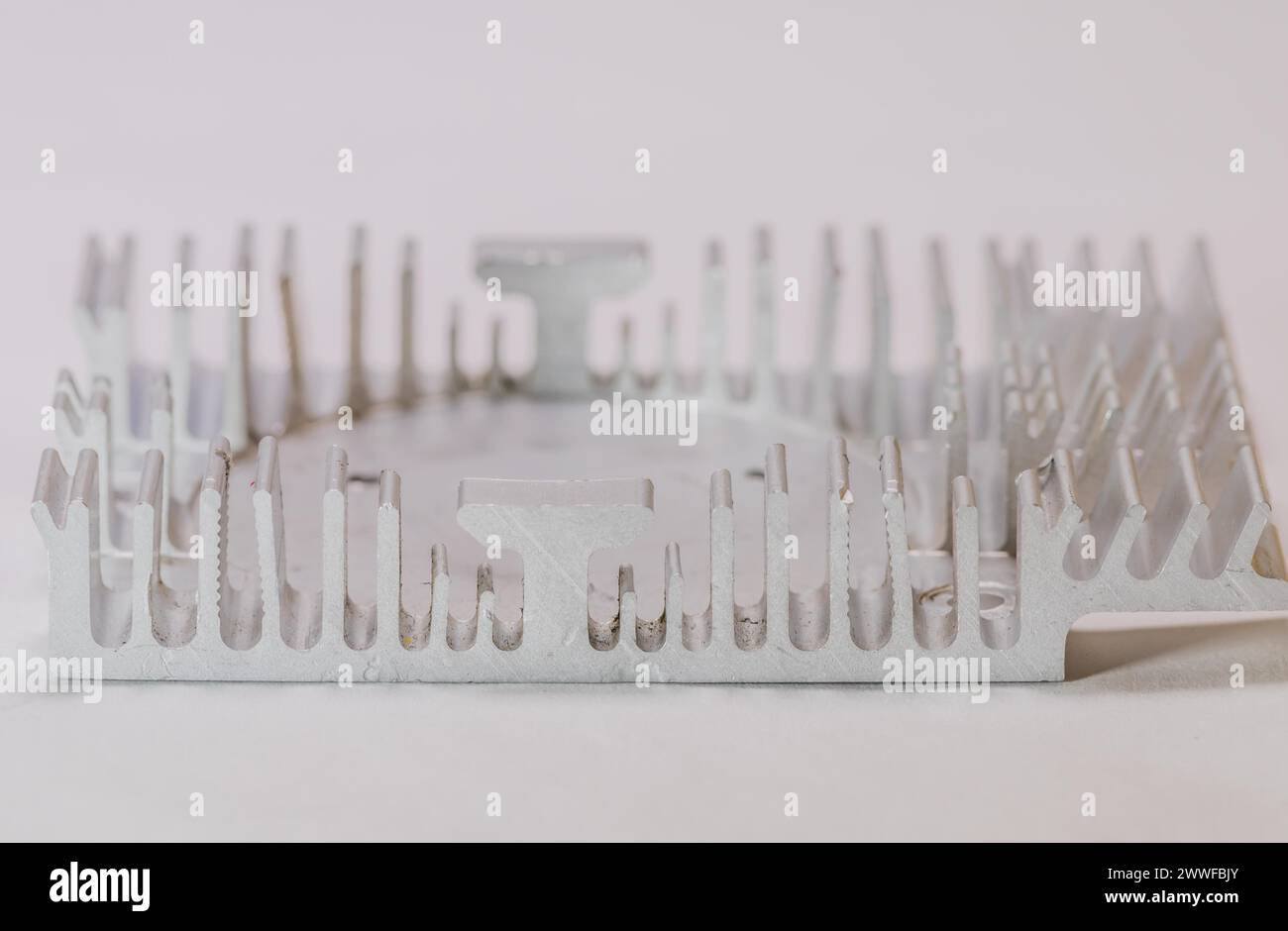 Closeup of fins of rectangle aluminum heat sink on white background ...