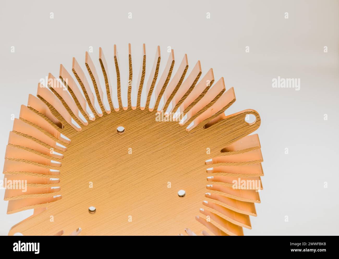 Closeup of mounting surface of round copper heat sink on white ...