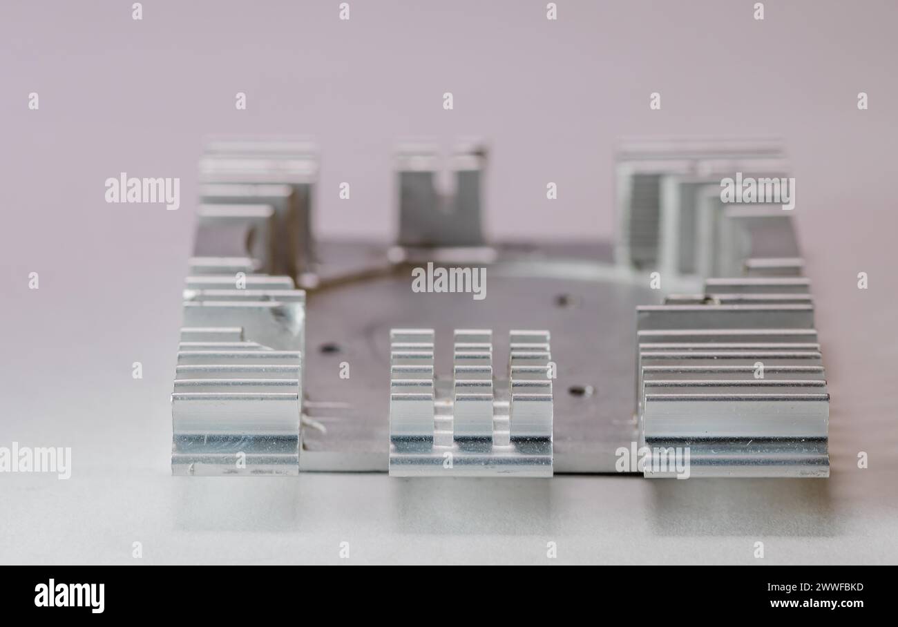 Closeup of fins of rectangle aluminum heat sink on white background ...