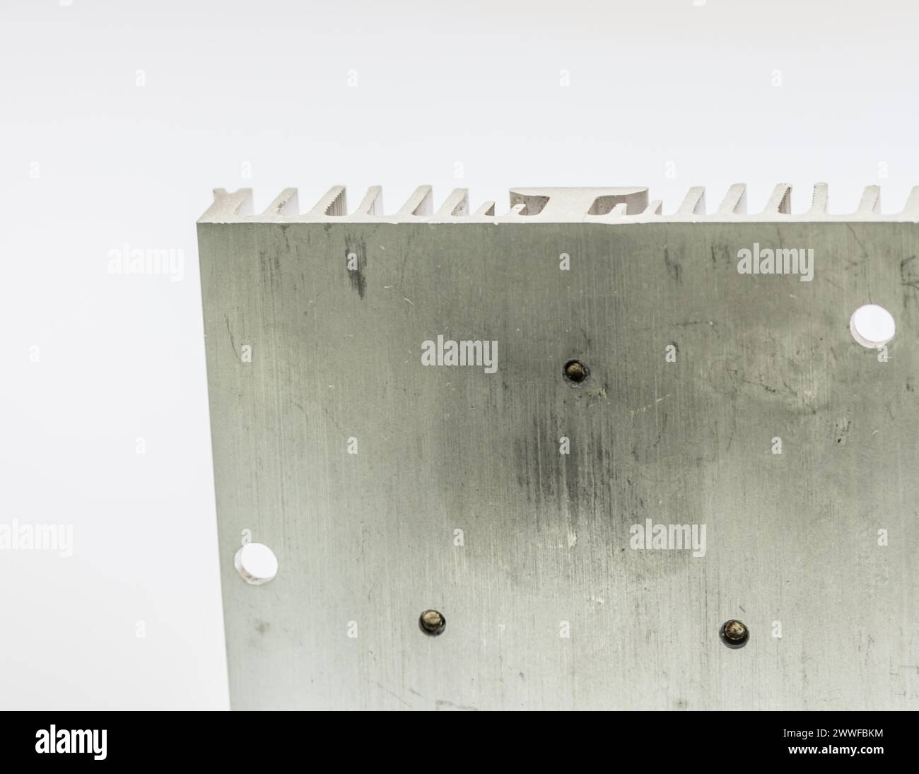 Closeup of mounting surface of rectangle aluminum heat sink on white ...