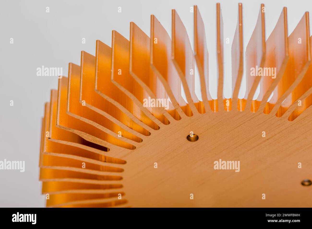 Closeup of fins and mounting surface on round copper computer heat sink ...