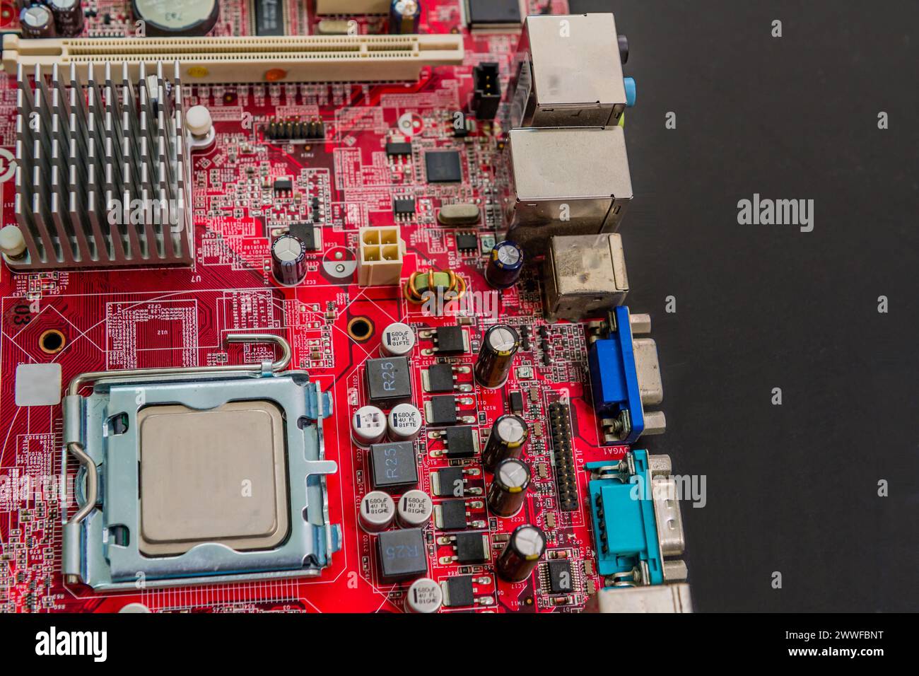 Closeup of computer mother board with installed cpu on black counter ...