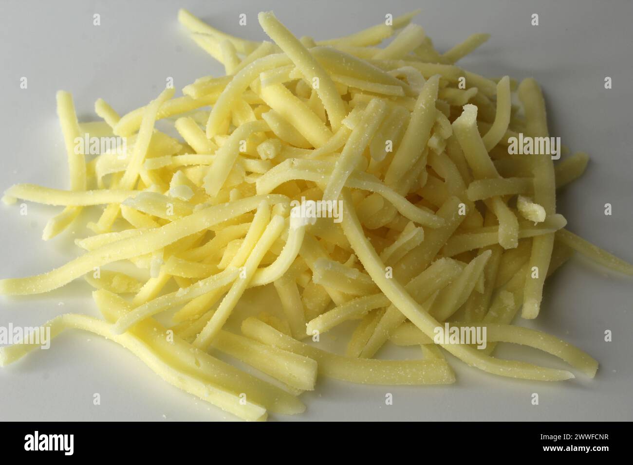 Grated cheddar cheese hi-res stock photography and images - Alamy
