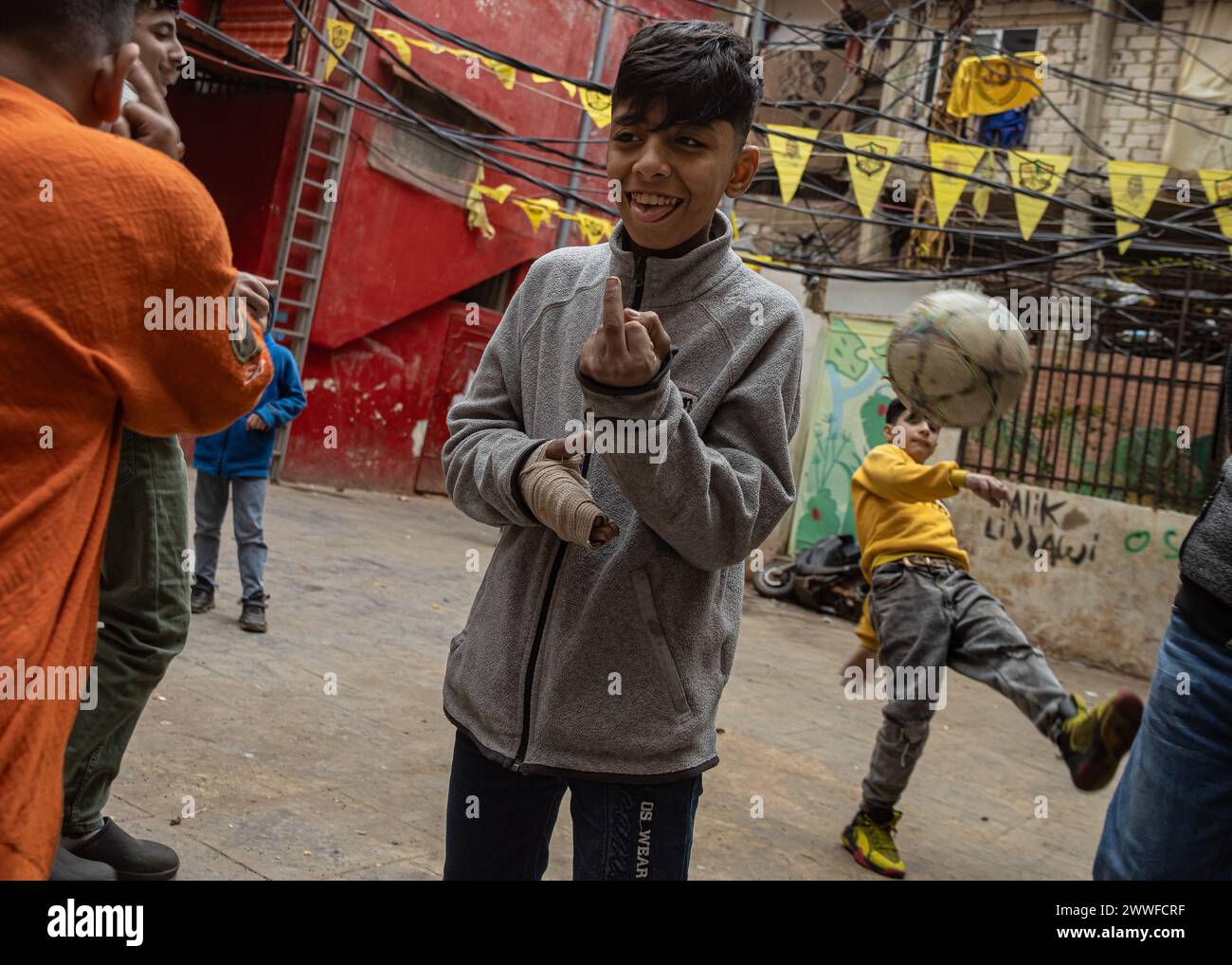 Palestinian refugee children play football hi-res stock photography and ...