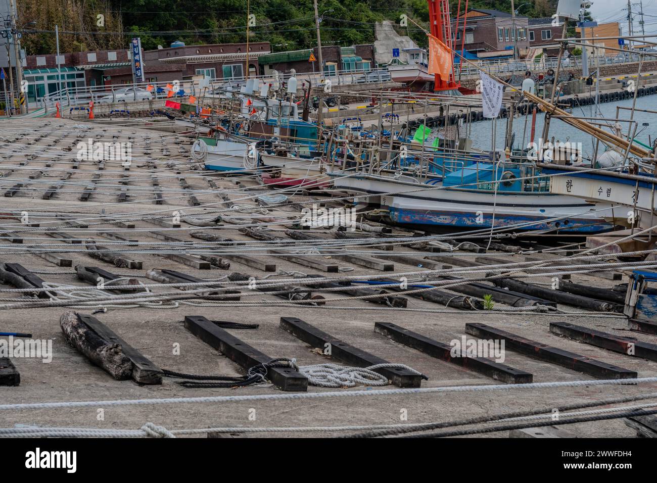 Array of ropes and mooring lines in a busy fishing boat dry dock on a ...
