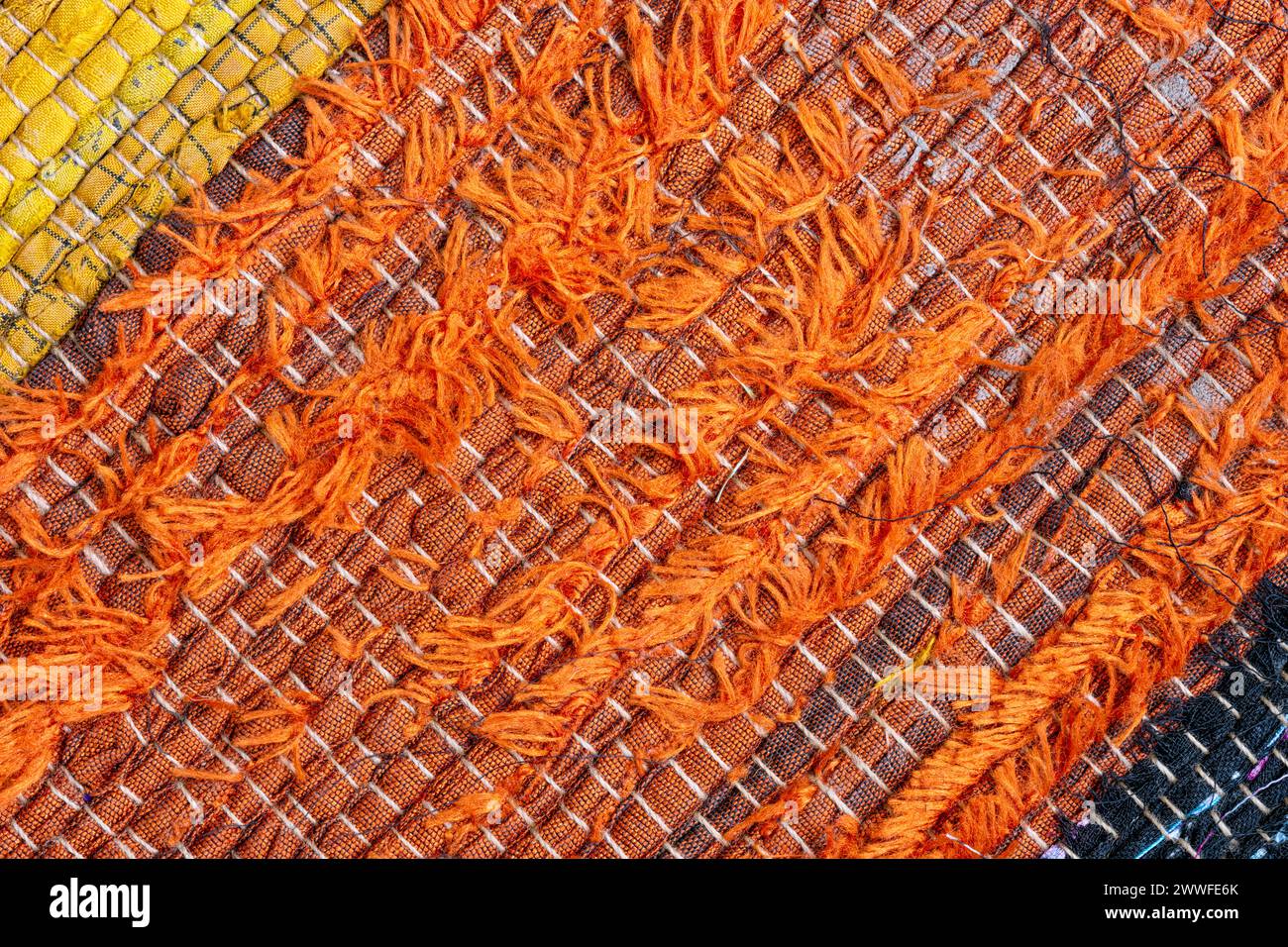 Details of orange thread patterns on a rag rug Stock Photo - Alamy