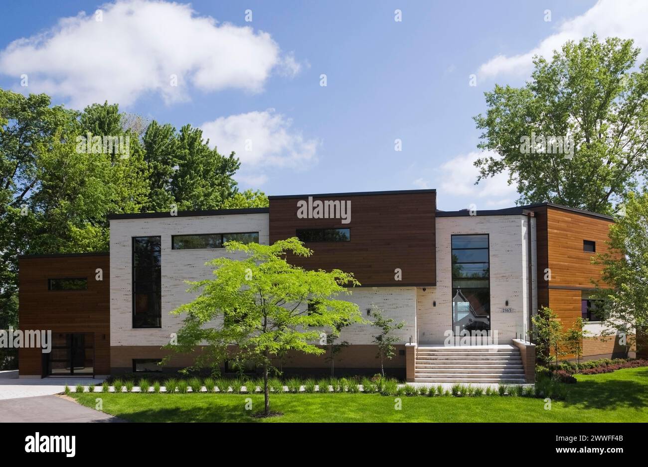 Beige stone with brown stained cedar wood modern cubist style ...