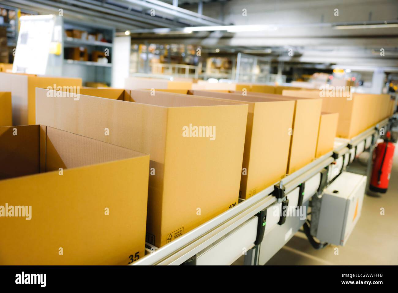 Cartons for dispatch on a conveyor belt in a logistics centre, Cologne ...