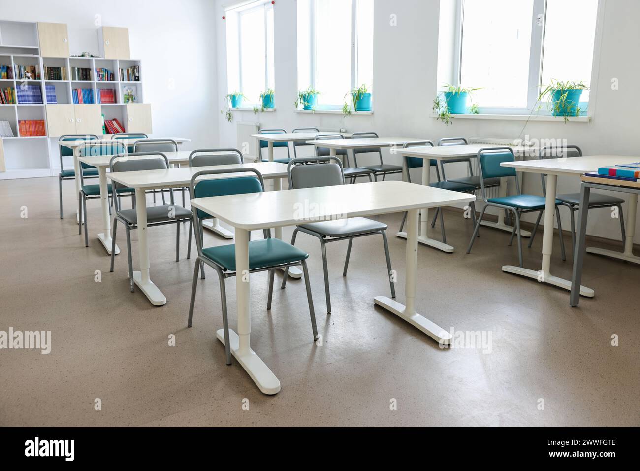 Empty school classroom with desks, windows and chairs Stock Photo - Alamy
