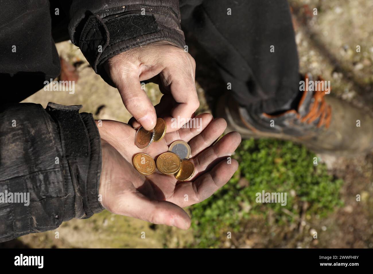 Homeless man counting money hi-res stock photography and images - Alamy