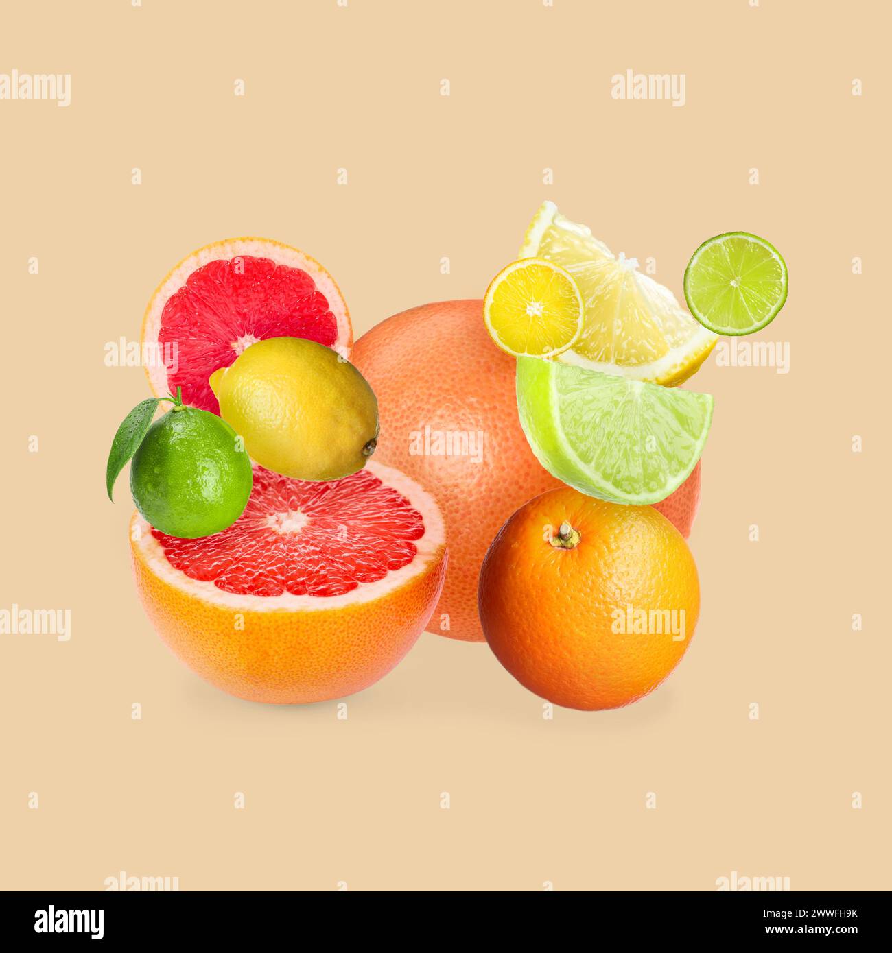 Stack of different citrus fruits on beige background Stock Photo - Alamy