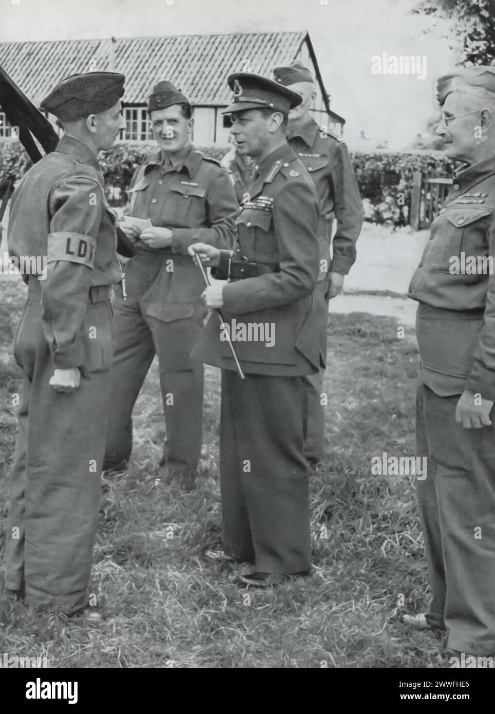A photograph captures King George VI interacting with the newly ...