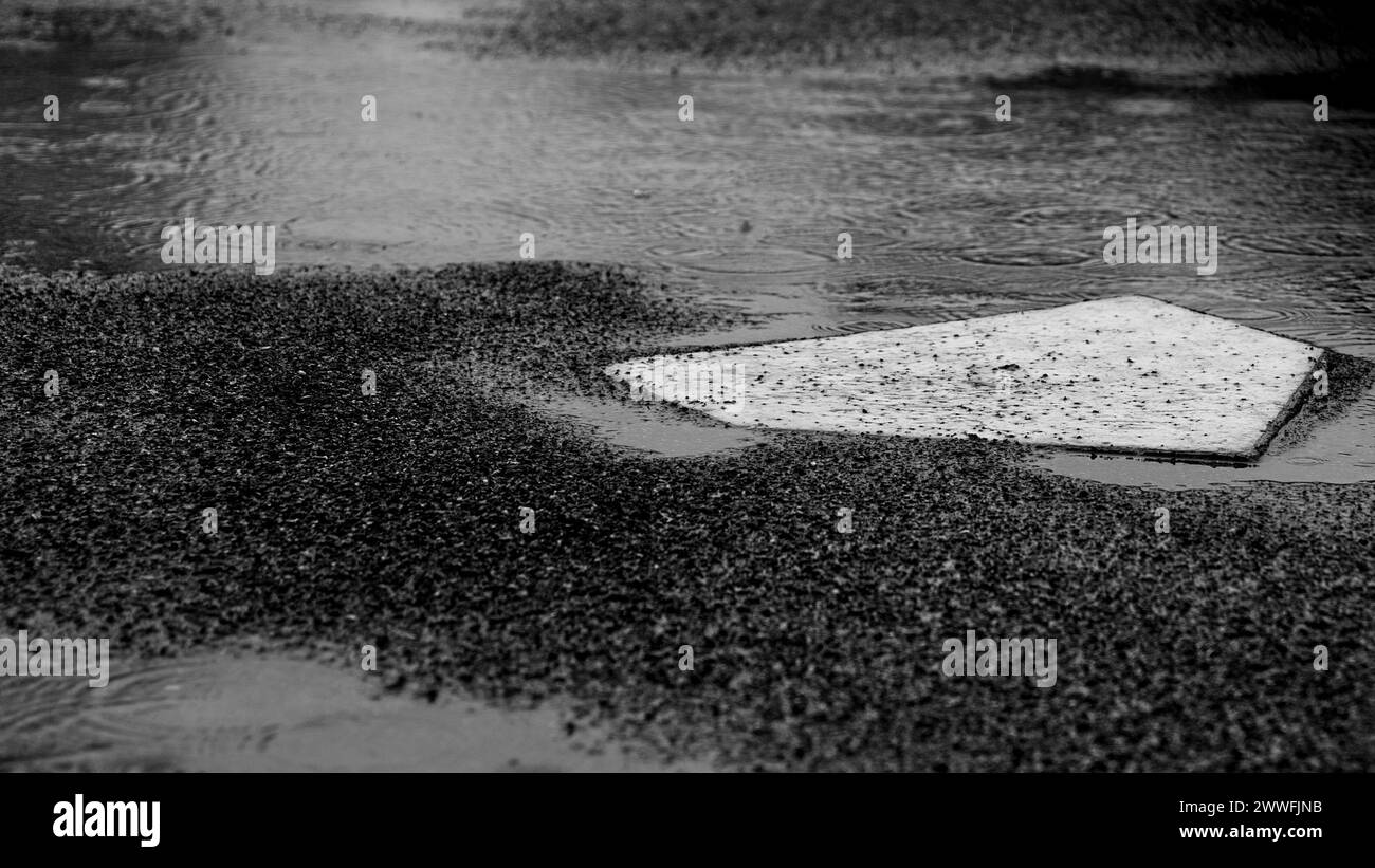 Home plate in the rain Stock Photo - Alamy