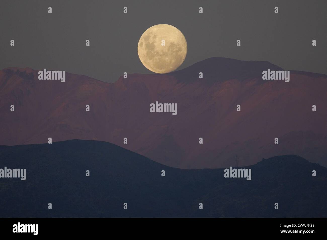 Santiago, Metropolitana, Chile. 23rd Mar, 2024. The nearly full moon ...