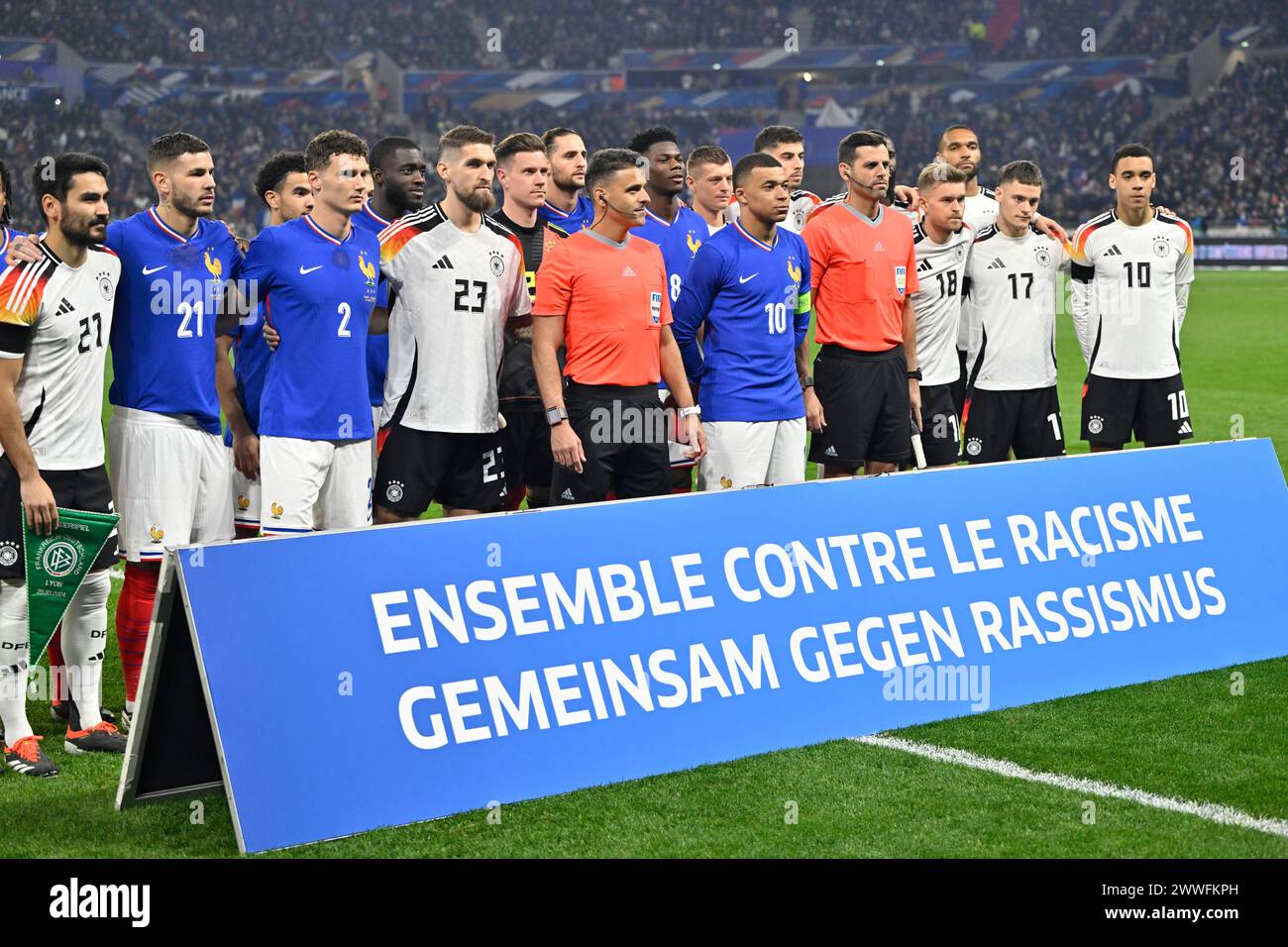 2LYON, France - 23. MARCH 2024: #1 Brice Samba, #2 Benjamin Pavard, #4 ...