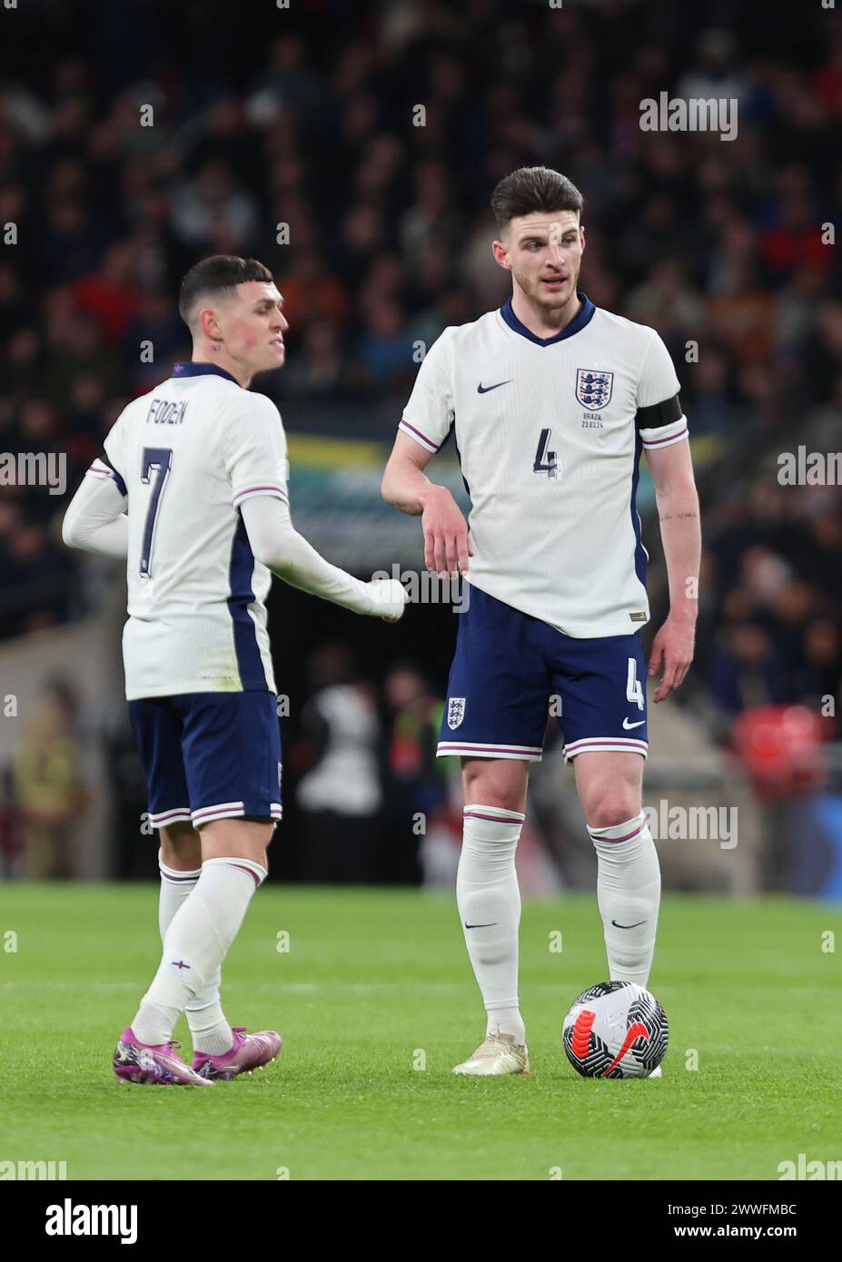 London, UK. 23rd Mar, 2024. Phil Foden (Man City)of England and Declan ...