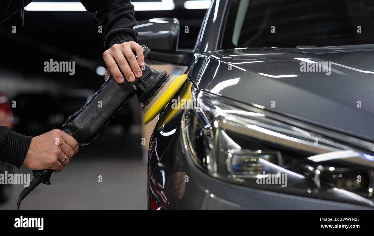A master polishes the surface of a car body Stock Photo - Alamy
