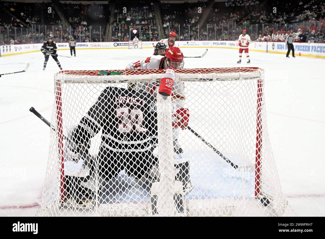 Denver Pioneers forward Rieger Lorenz (14) scores the final goal in the ...