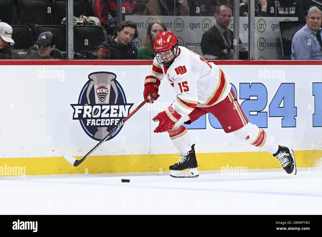 Denver Pioneers forward Carter King (15) skates up the ice during the ...