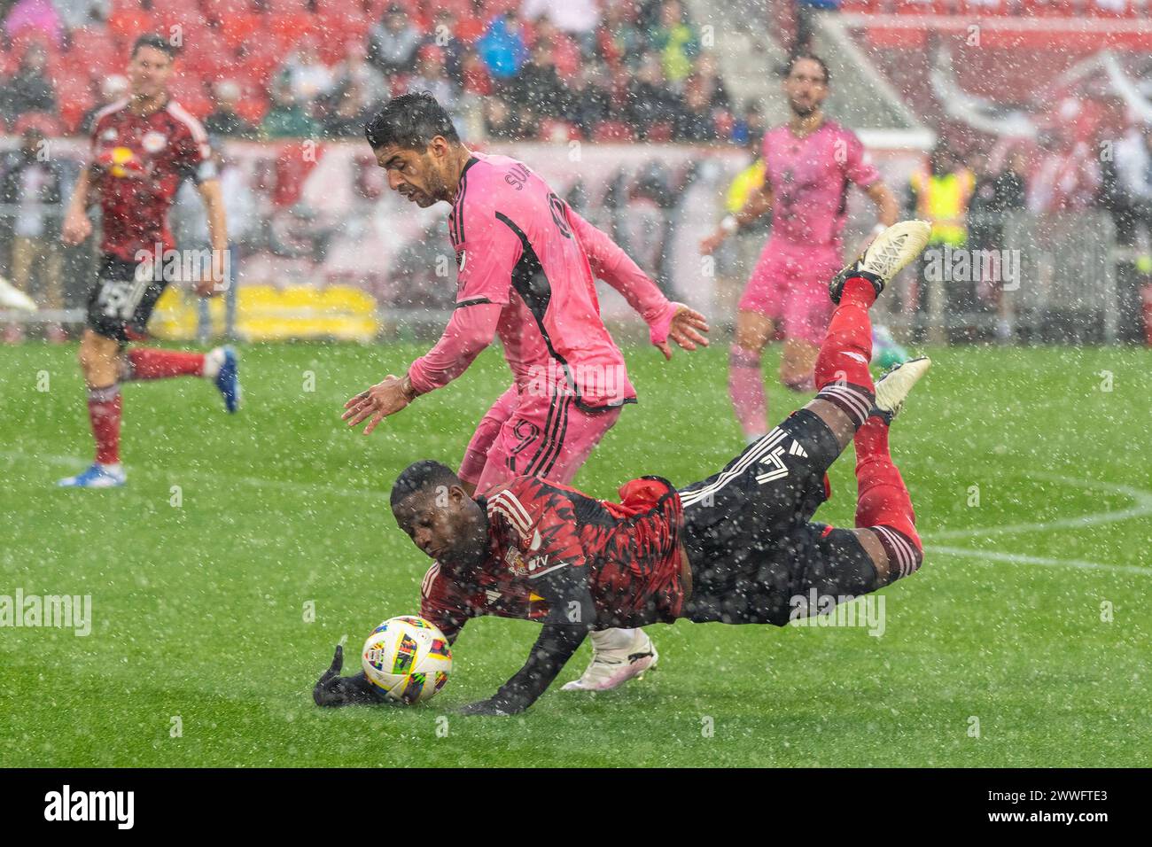 Harrison, USA. 23rd Mar, 2024. Luis Suarez (9) of Miami fouls Andres ...