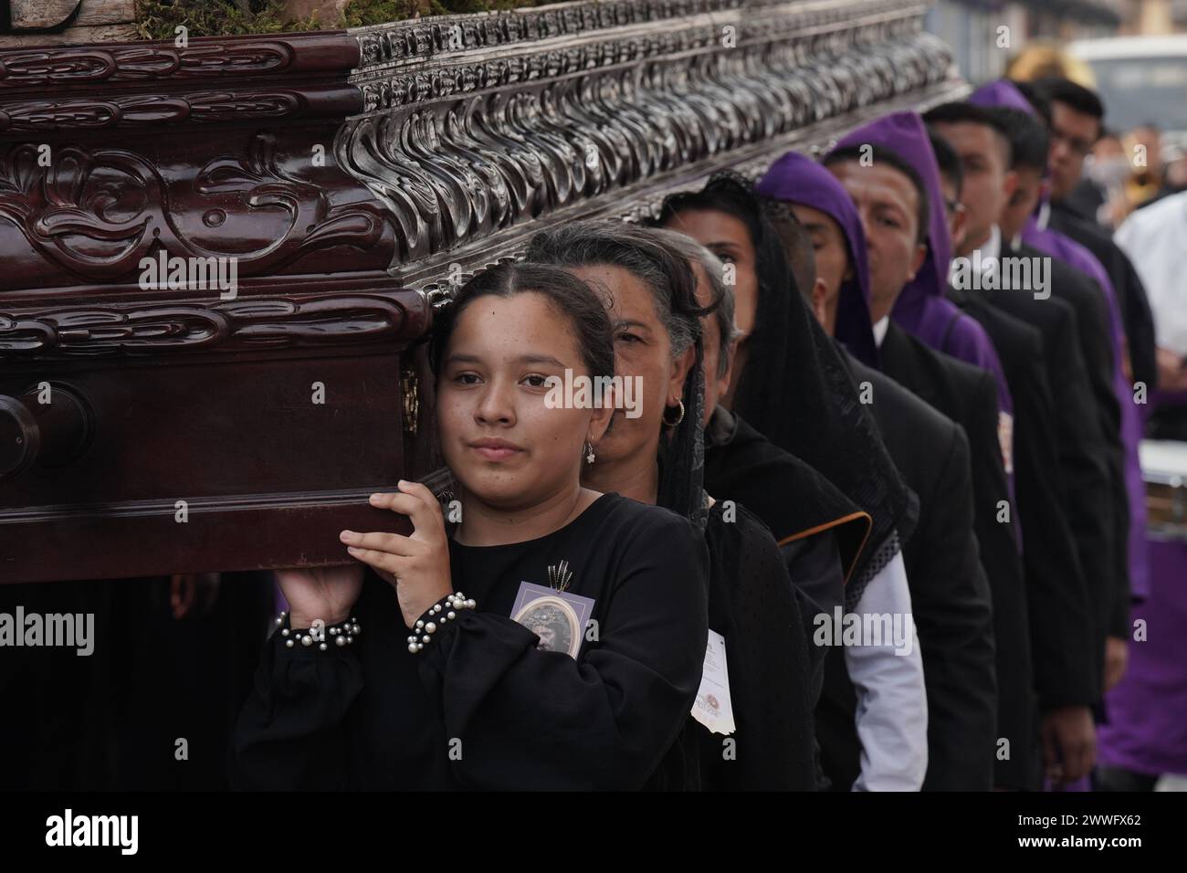 Antigua, Guatemala. 23rd Mar, 2024. Penitents carry a massive ...
