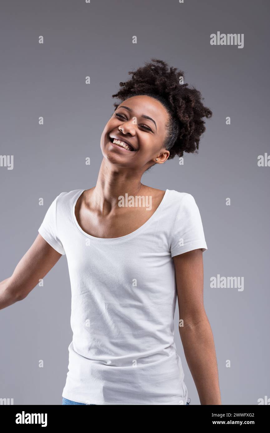 The front-facing portrait showcases a gleeful woman, her joyful energy ...
