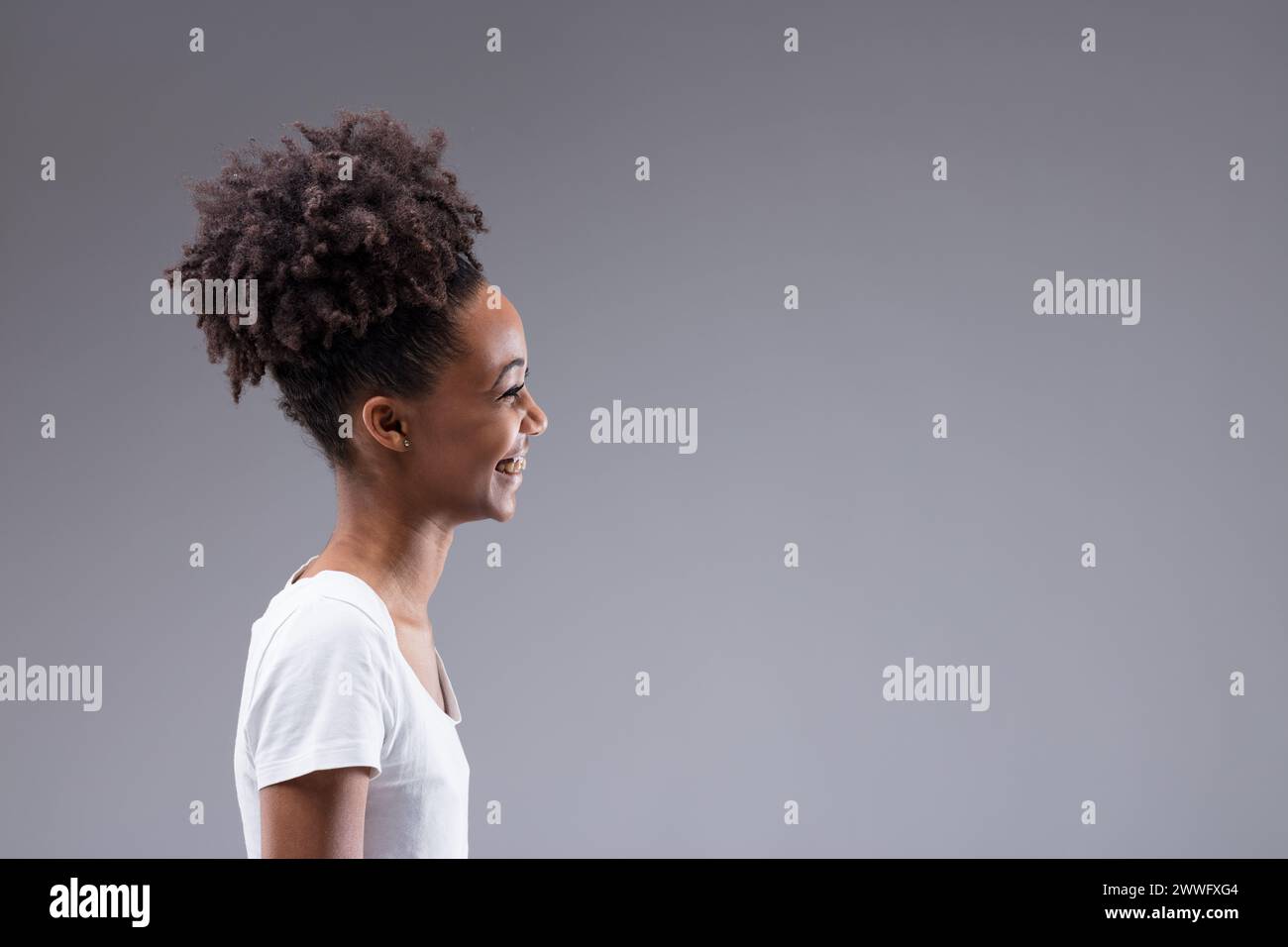 Beaming with delight, her profile captures the essence of joy, natural ...