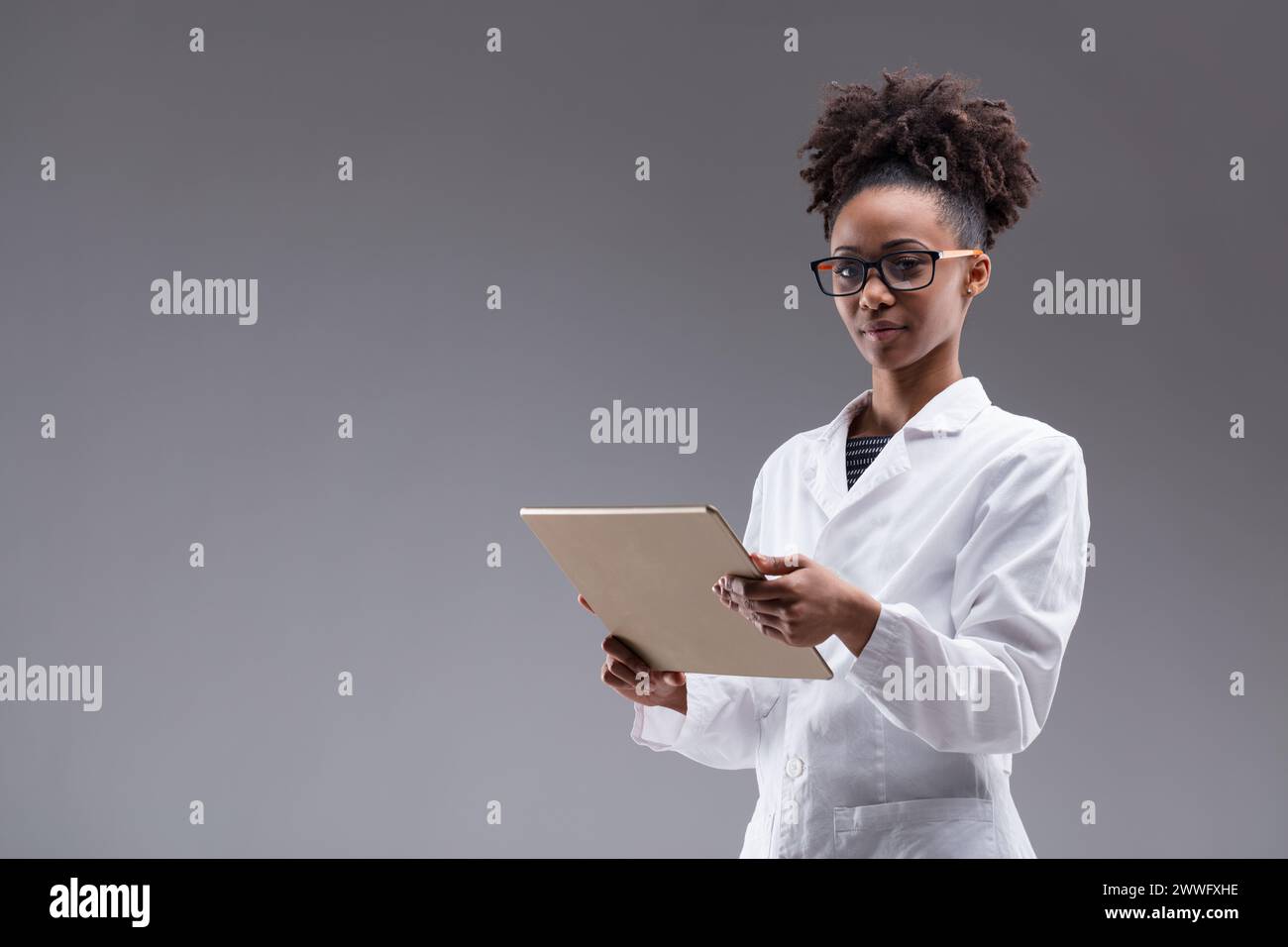 With a thoughtful expression, this scientist navigates through complex ...