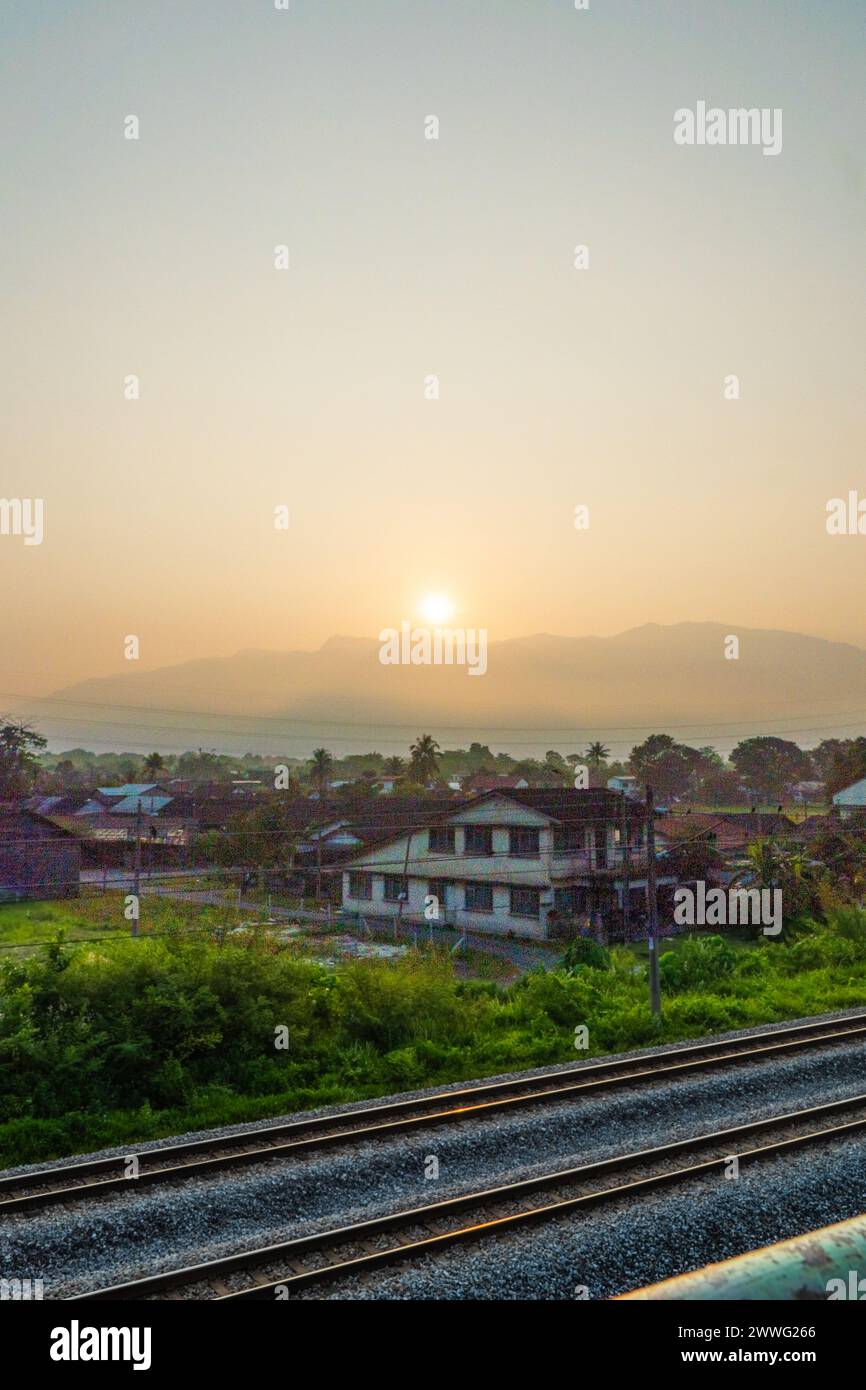 Beautiful potrait view of sunrise shining the orange sky Stock Photo ...