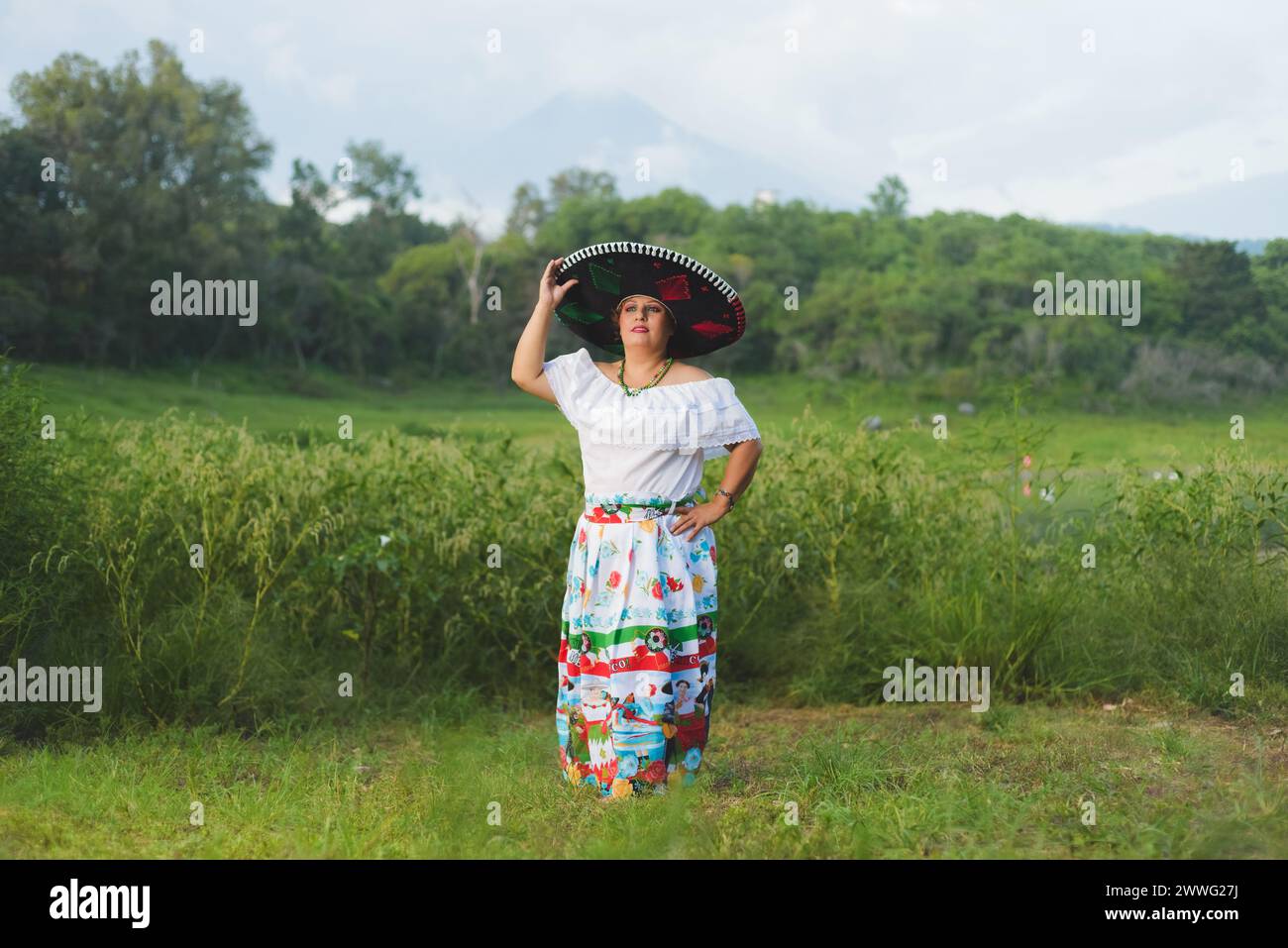 Woman with Mexican hat in rural scenery. Cinco de Mayo celebration in ...