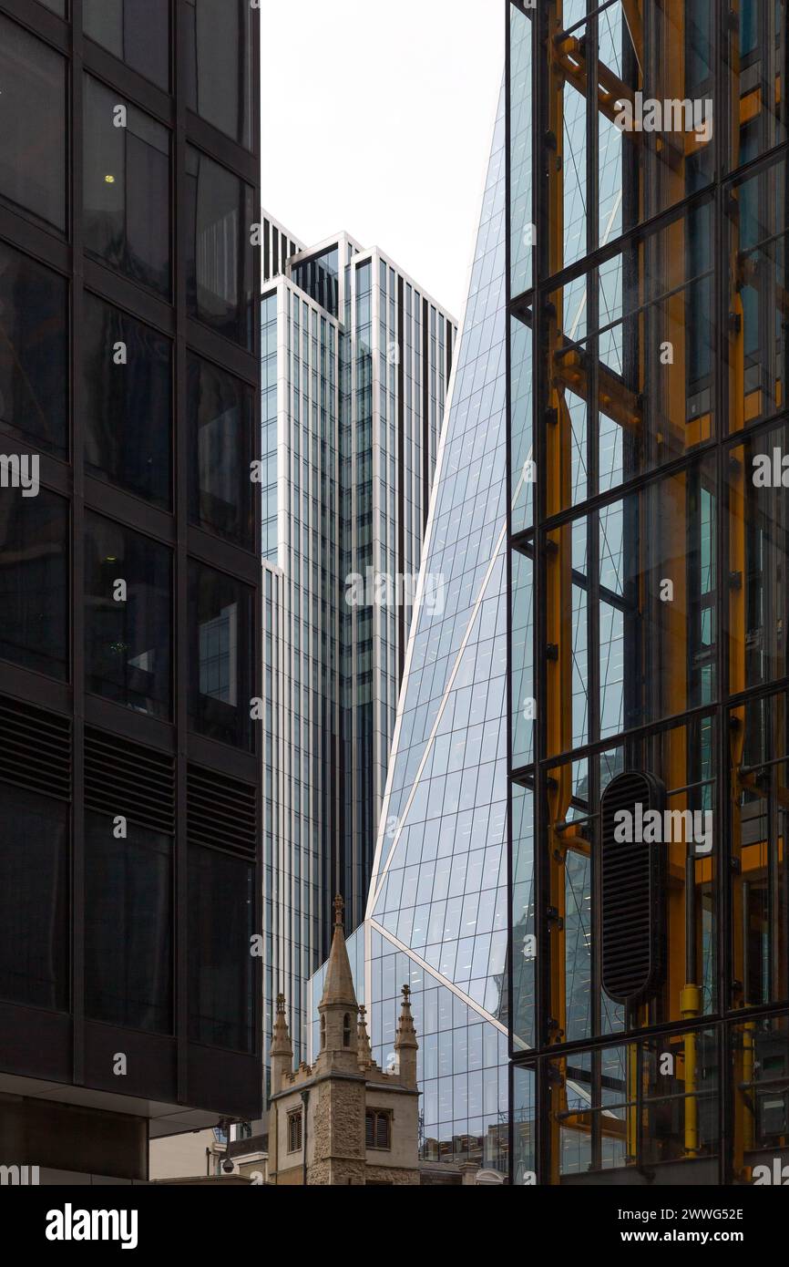 LONDON, UK - MARCH 19, 2024: Modern offices dwarfing St Andrew ...