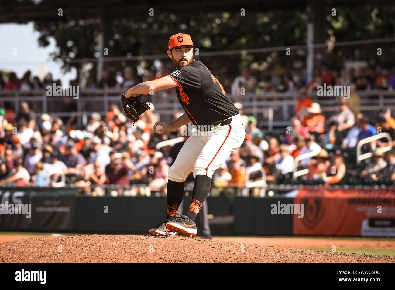 San Francisco Giants relief pitcher Ryan Walker (74) throws against the Arizona Diamondbacks in ...