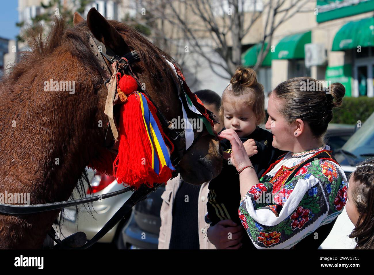 Bucharest, Romania. 23rd Mar, 2024. A woman and her child interact with ...