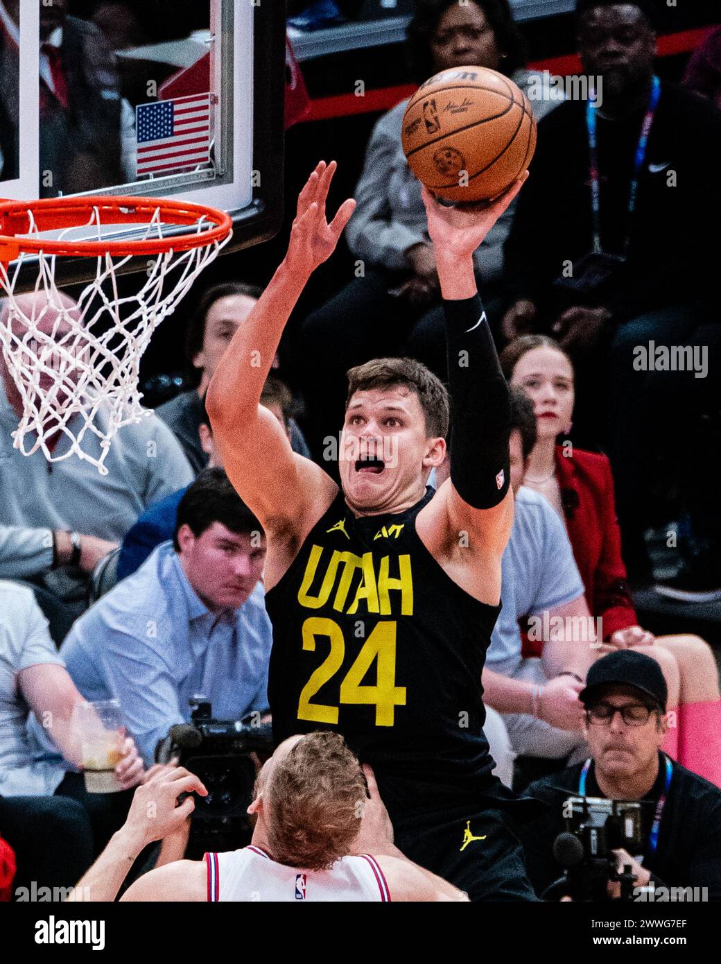Houston, USA. 23rd Mar, 2024. Walker Kessler (top) of Utah Jazz goes ...