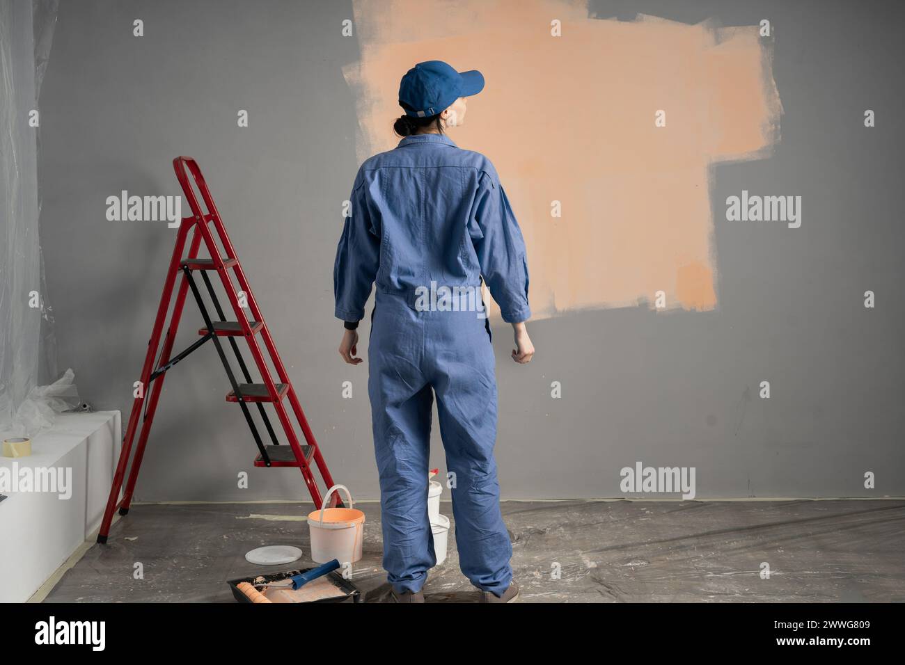 Rear view girl paintbrush hi-res stock photography and images - Alamy