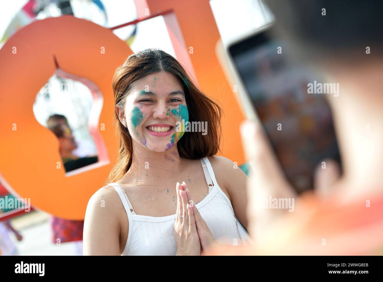 Pattaya, Thailand. 23rd Mar, 2024. A woman poses for photos with ...