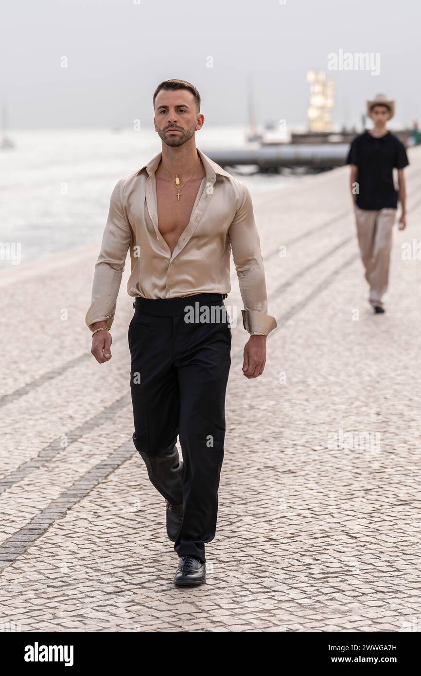 Lisbon, Portugal. 23rd Mar, 2024. A model walks the runway during Nuno ...