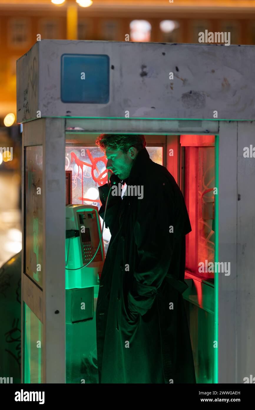 Phone booth night man hi-res stock photography and images - Alamy