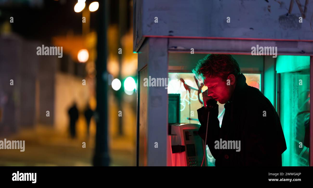 Phone booth night man hi-res stock photography and images - Alamy