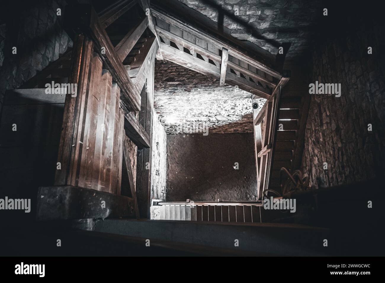 The rustic wooden staircase of an old castle invites mystery Stock ...