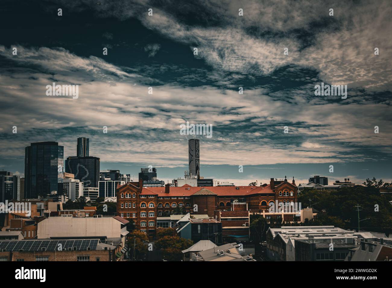 Dramatic clouds hover over an eclectic mix of modern and historic city ...