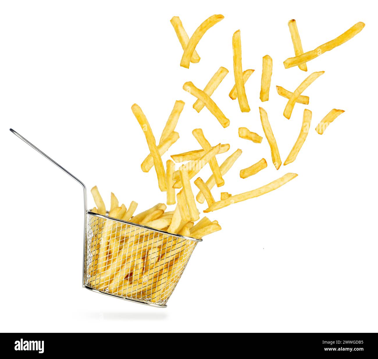 French fries flying out of falling stainless steel fryer basket ...