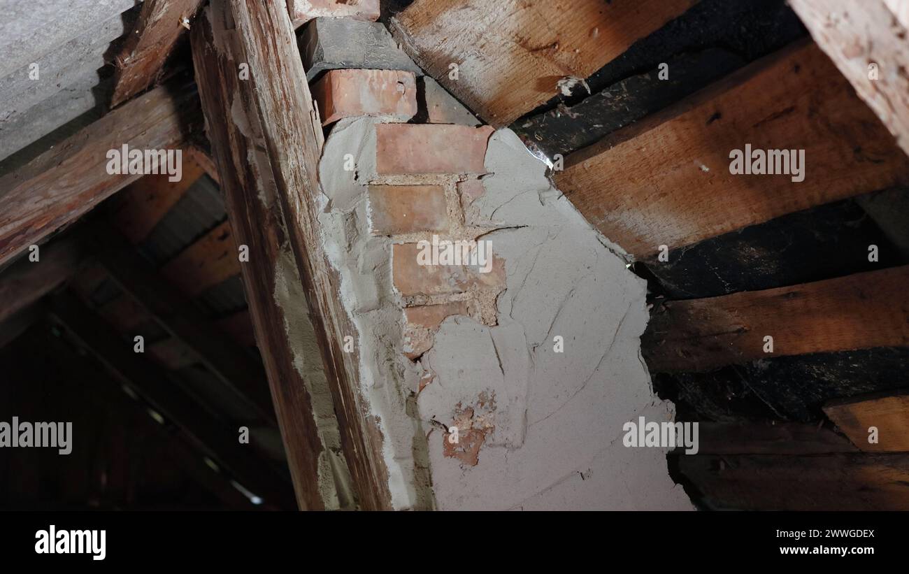 The stovepipe plasterer is plastering the wall of the stove pipe Stock ...