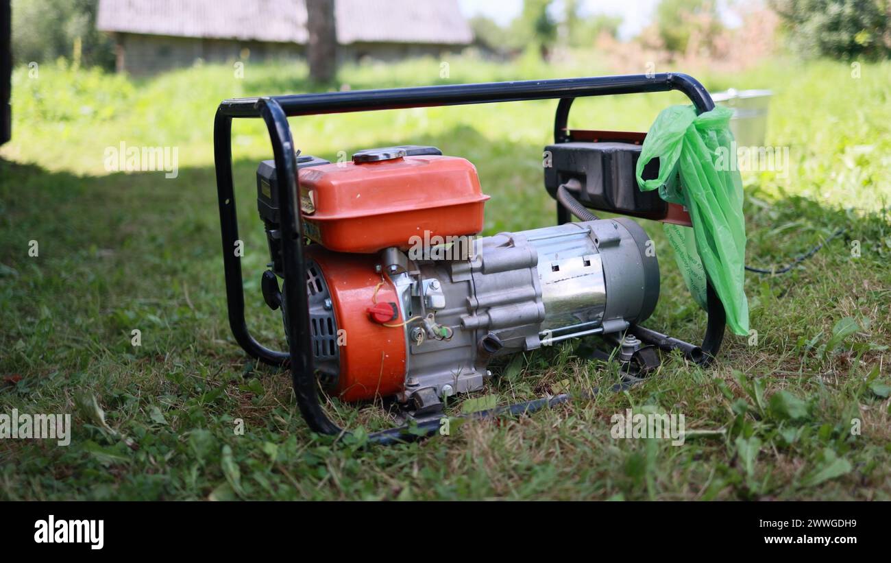 Gasoline-powered electric generator in a state of operation Stock Photo ...
